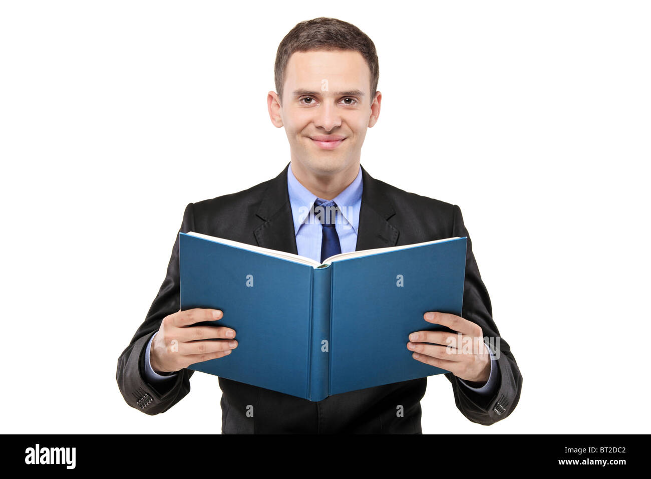 A young businessman reading a book Stock Photo - Alamy