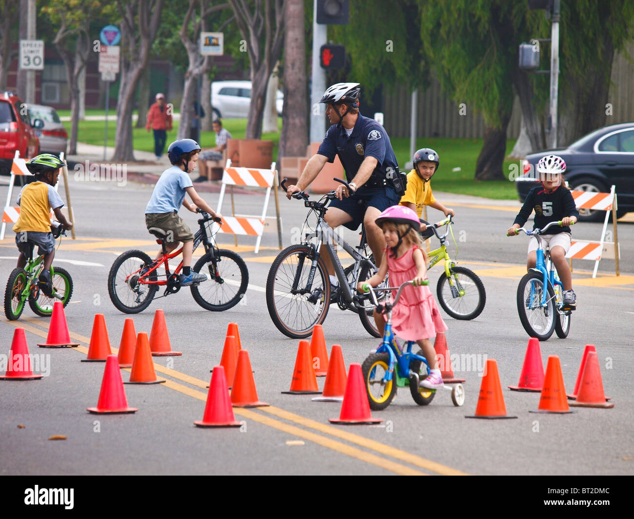 Redondo police officer leads children through pylons as part of the ...