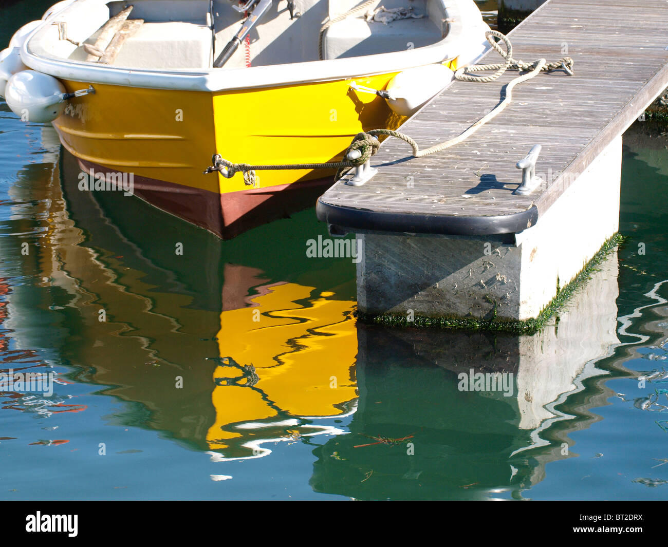 Reflections of boat in harbour, Padstow, UK Stock Photo - Alamy