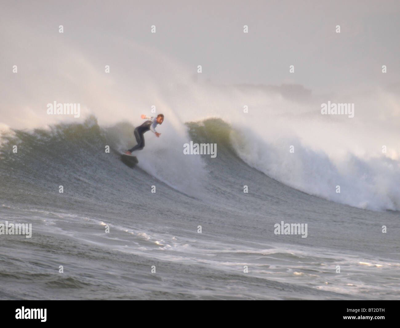 Surfer on a large wave, Bude, Cornwall, UK Stock Photo - Alamy