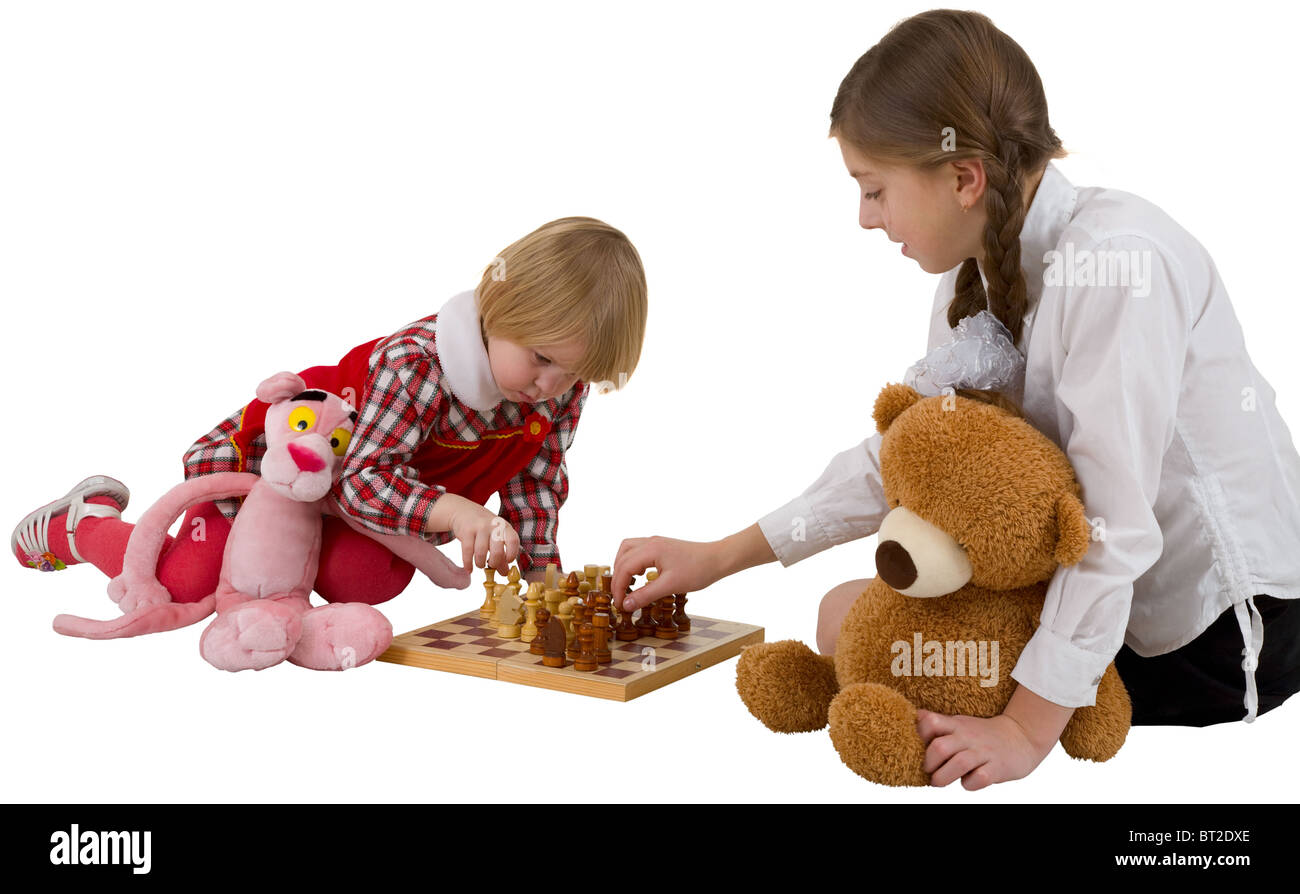 Girls play wooden classical chess on white Stock Photo - Alamy