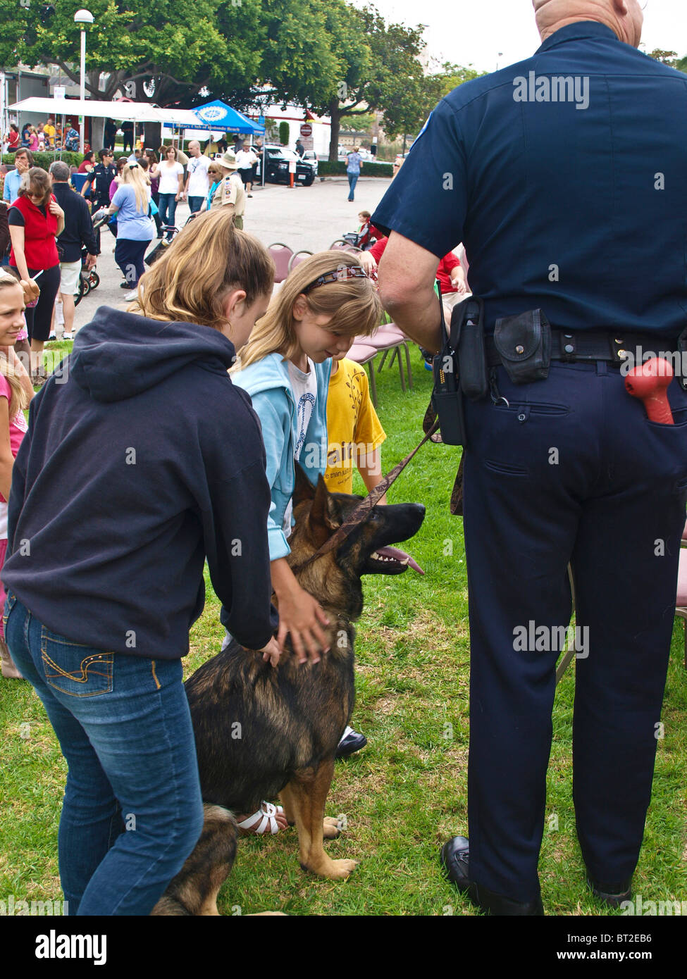 Children pet police dog, after K9 demo Stock Photo - Alamy
