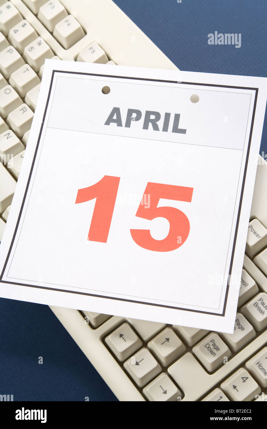 Tax Day, calendar date April 15 and keyboard for background Stock Photo ...