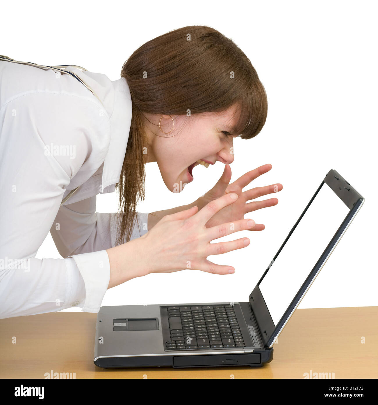 Young girl emotionally shouts at the laptop Stock Photo - Alamy