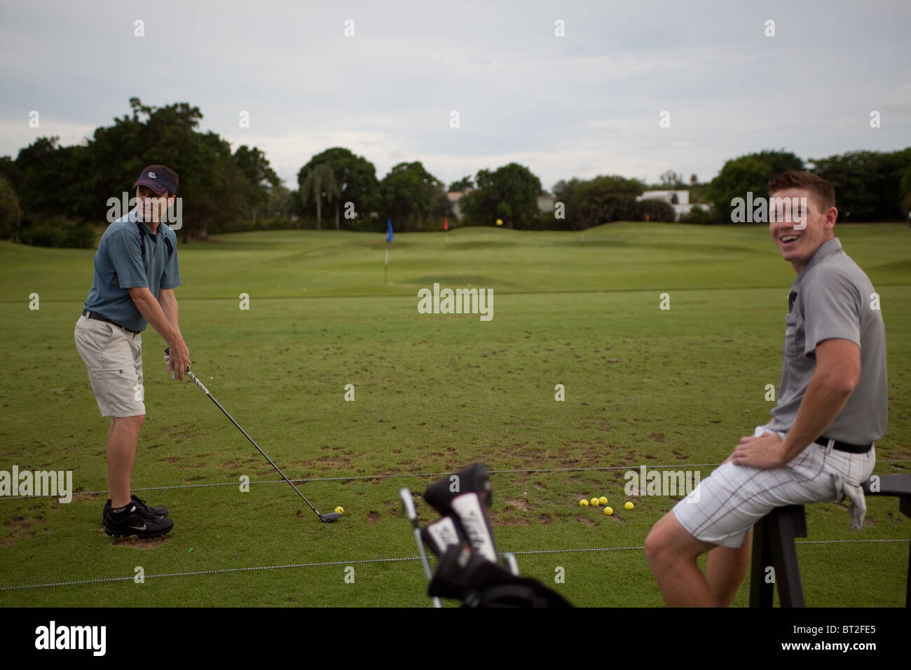 Two golfers tease each other Stock Photo - Alamy