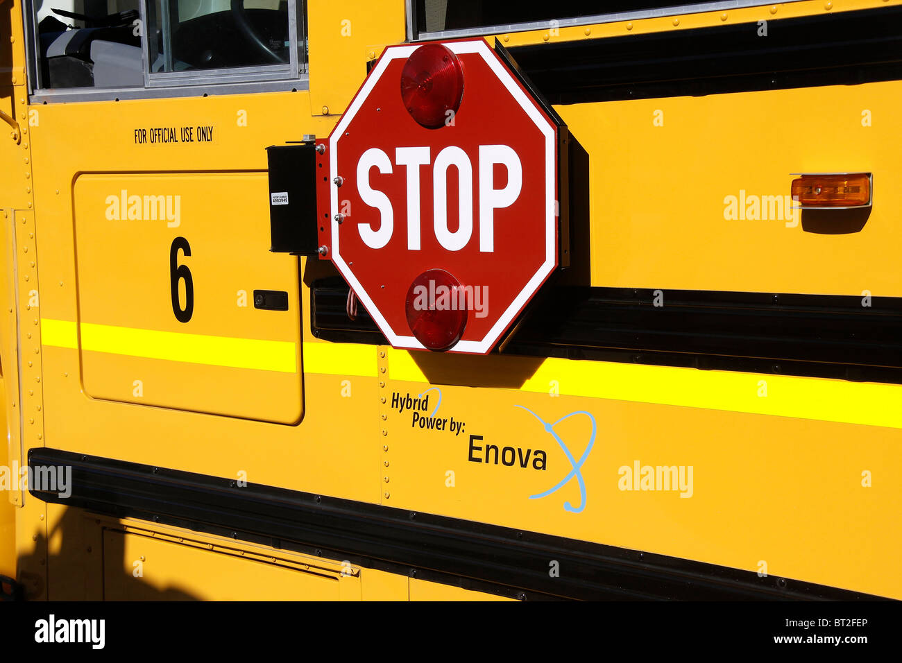 Stock image of a hybrid school bus on display promoting alternative ...