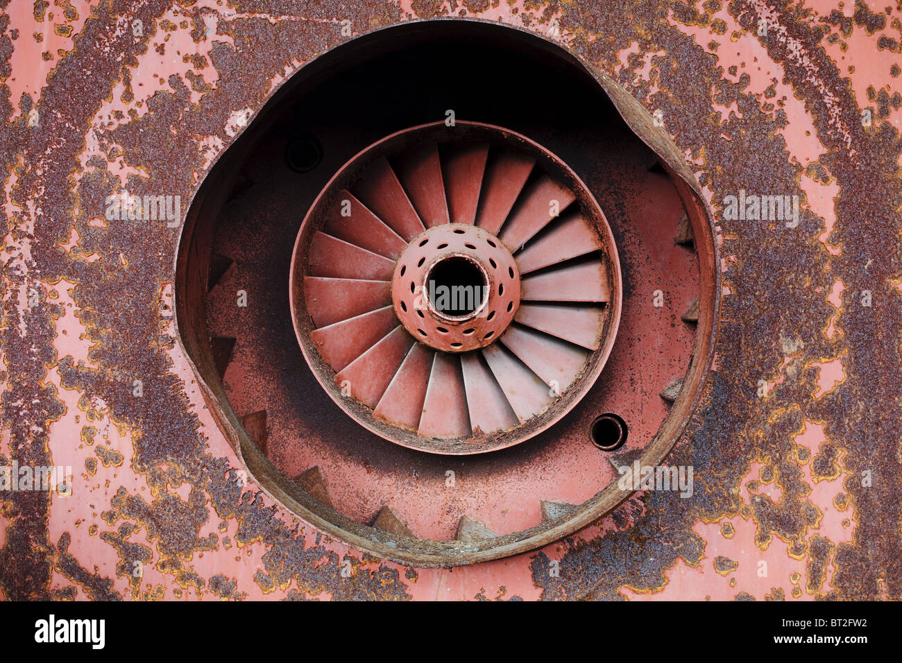 Old rusty turbine on metal peel off background Stock Photo - Alamy