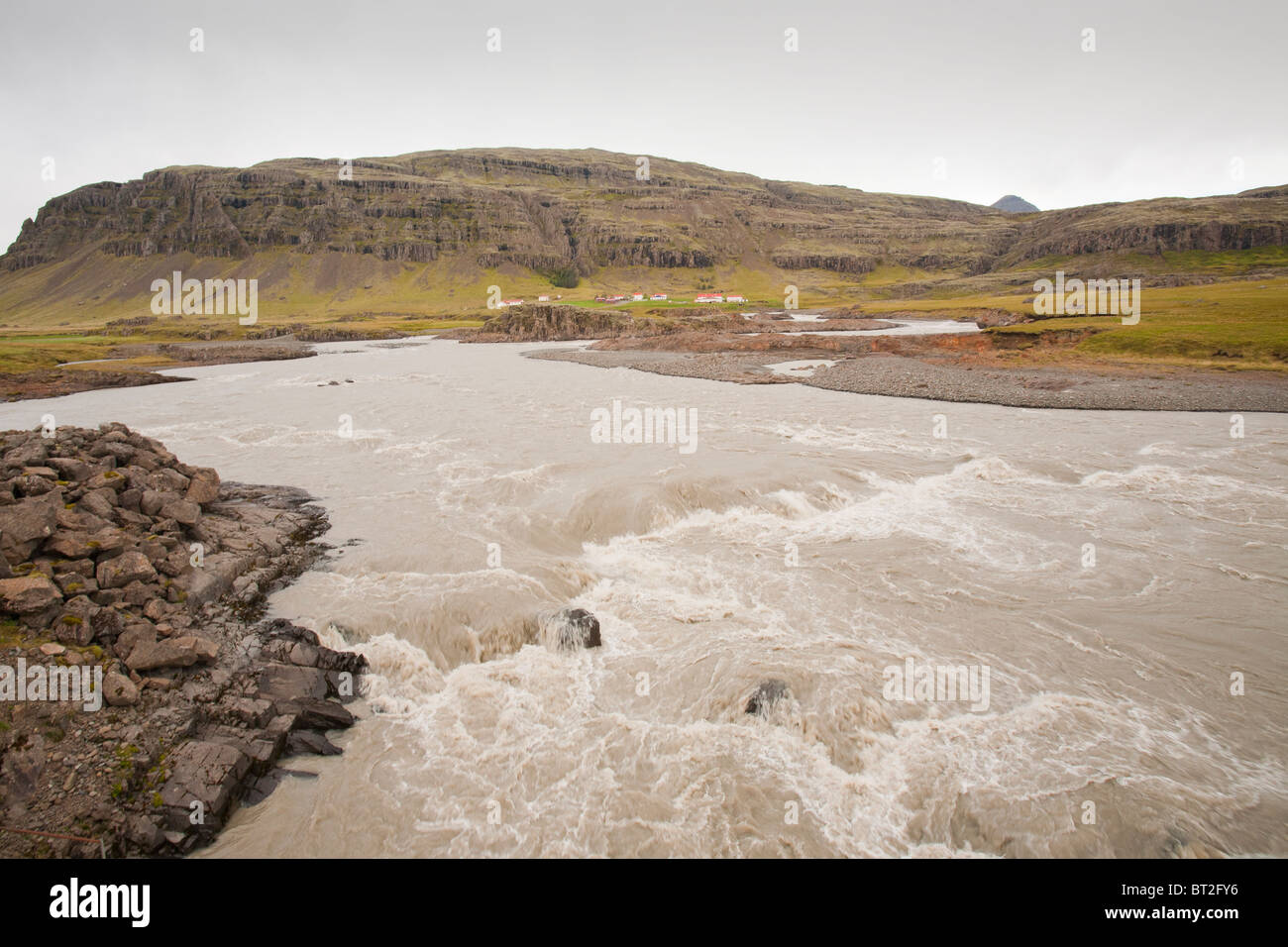 A river full of meltwater from the Vantnajokull ice sheet on Iceland's ...