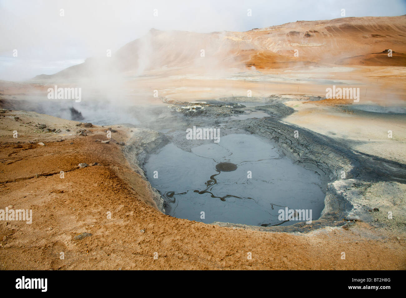 Bubbling mud pools in the geothermal area of Hverir near Myvatn ...