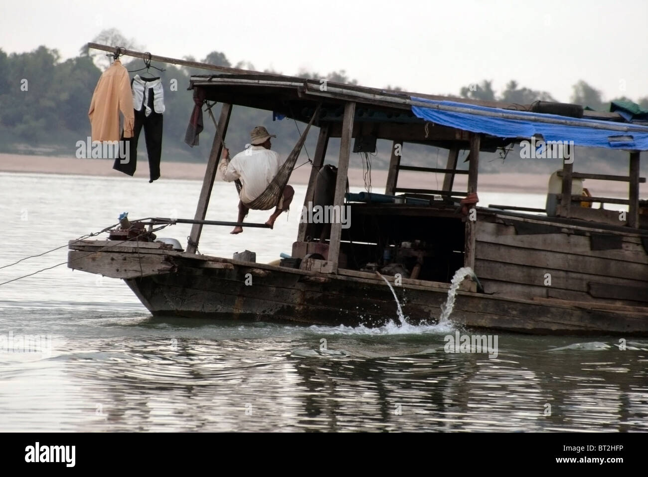 Man riding boat hi-res stock photography and images - Alamy