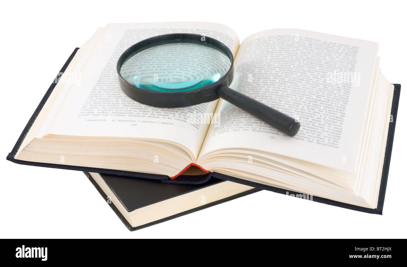 Open book and magnifier on a white background Stock Photo - Alamy