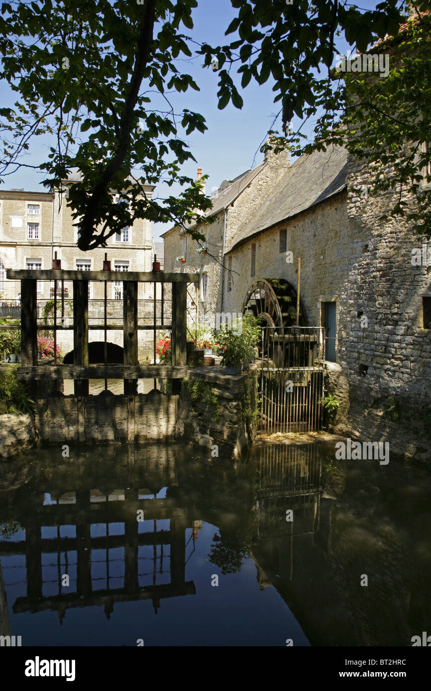 Old watermill with waterwheel alongside the River Aure in Bayeux ...