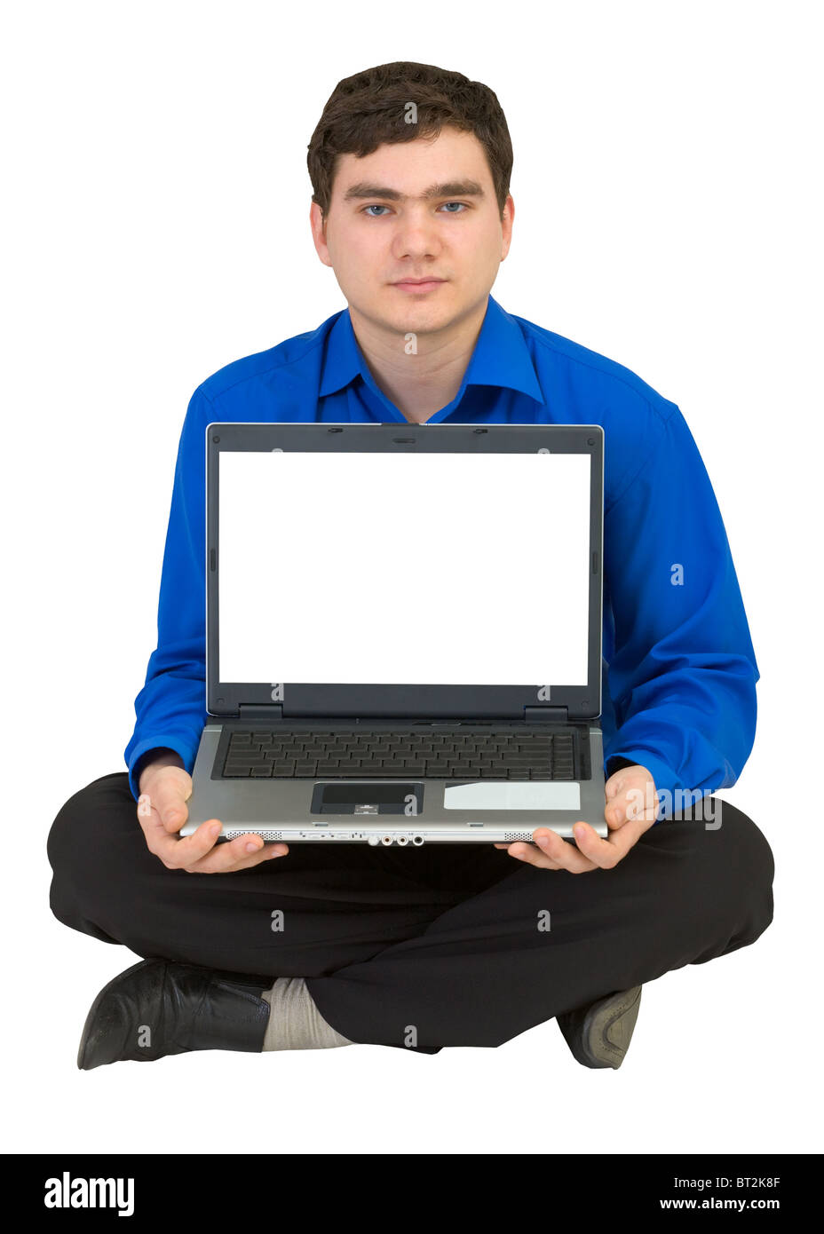 Guy sits on a floor with the laptop in a lap Stock Photo - Alamy