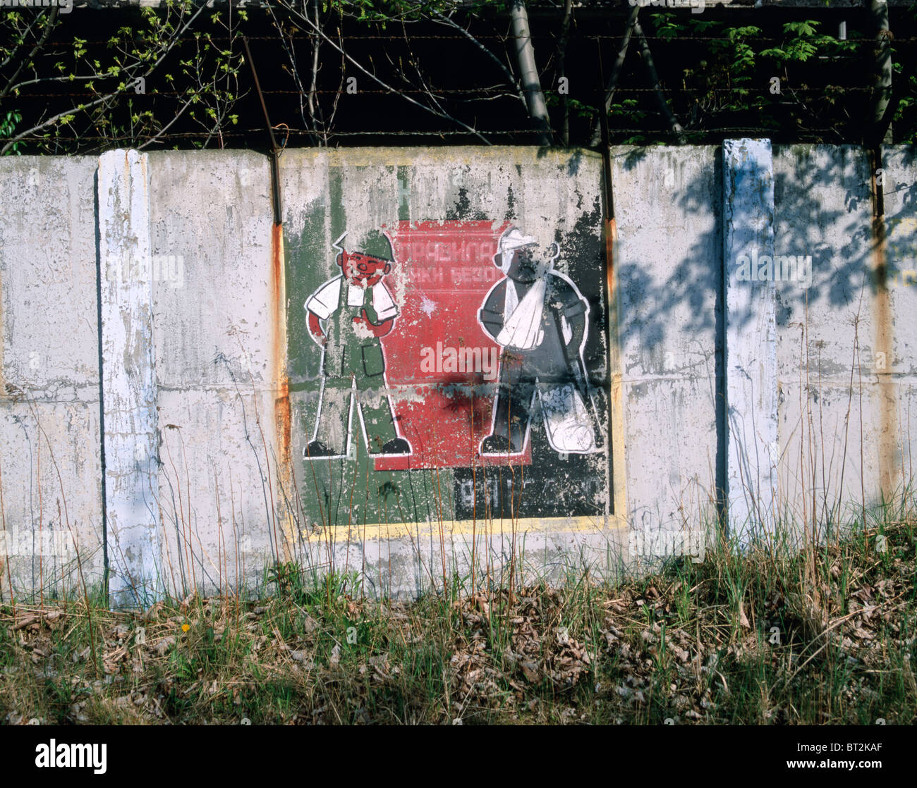 Graffiti on a concrete wall depicting safety regulation (protection) in ...