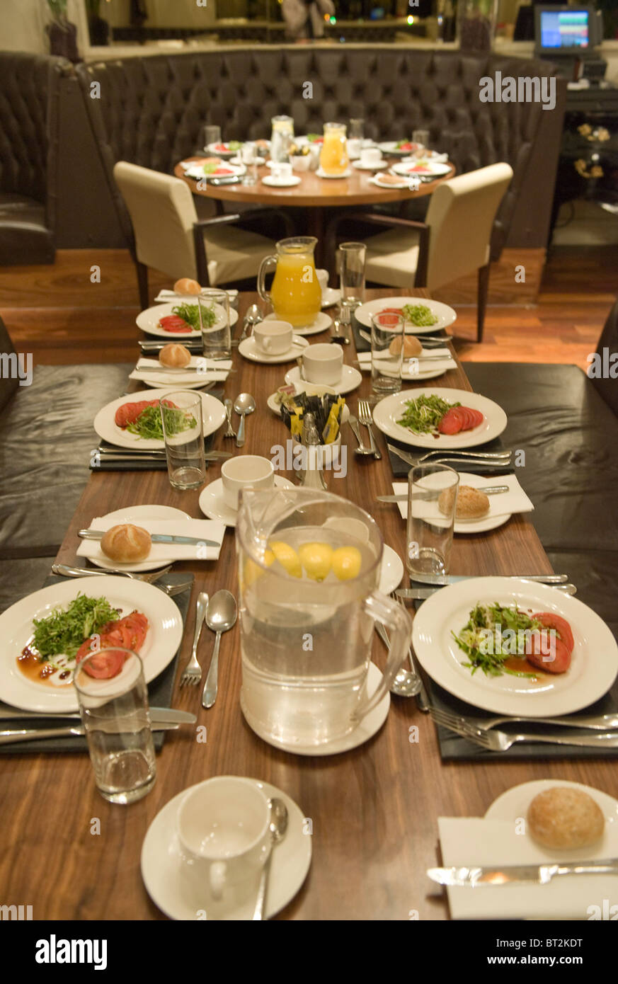 Table set for business lunch Stock Photo - Alamy
