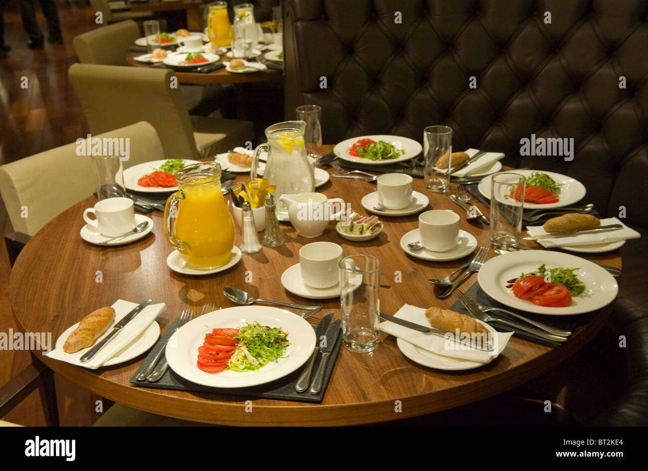 Table set for business lunch Stock Photo - Alamy