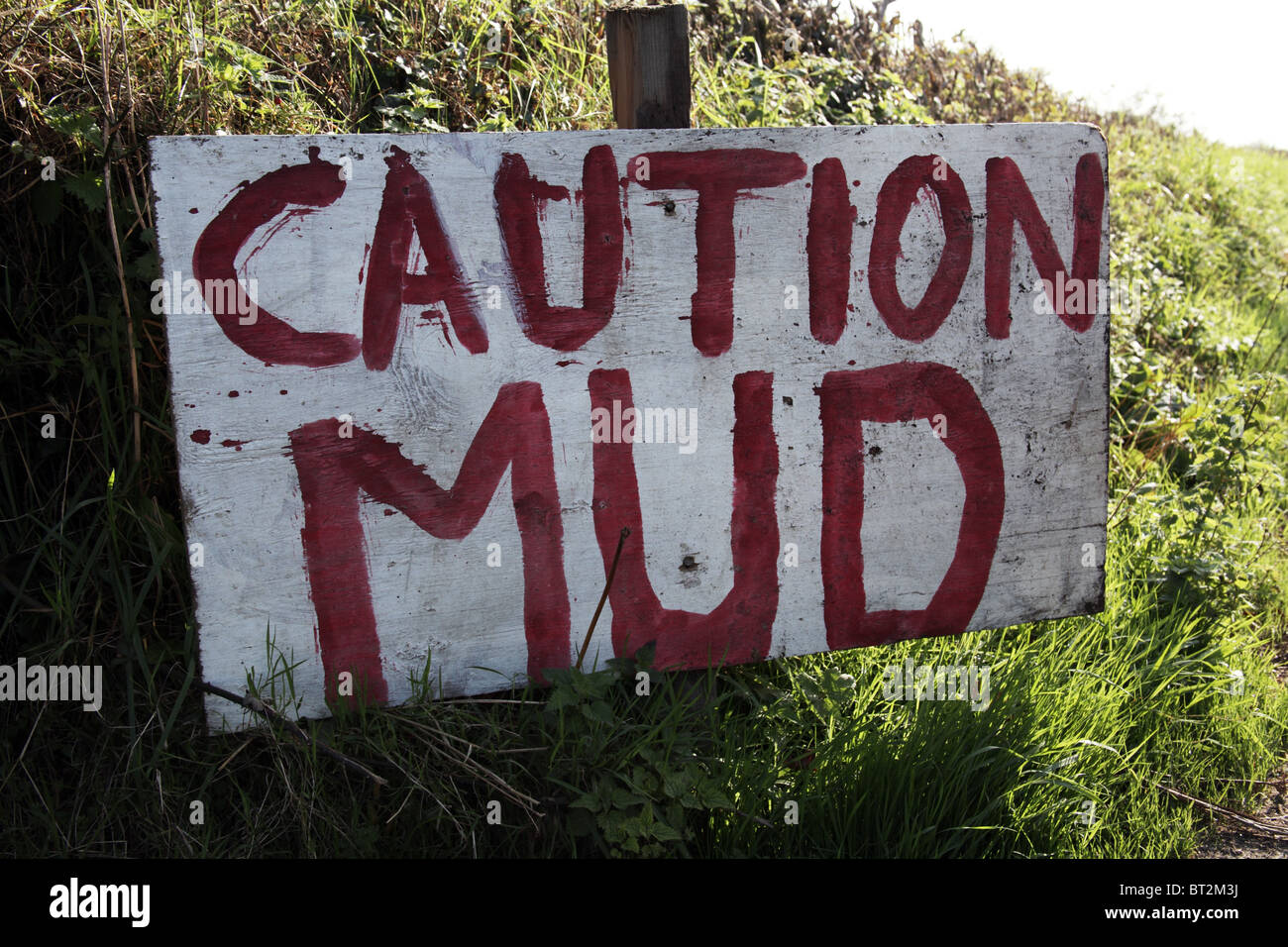 Caution Mud. Handwritten sign on country road Stock Photo - Alamy