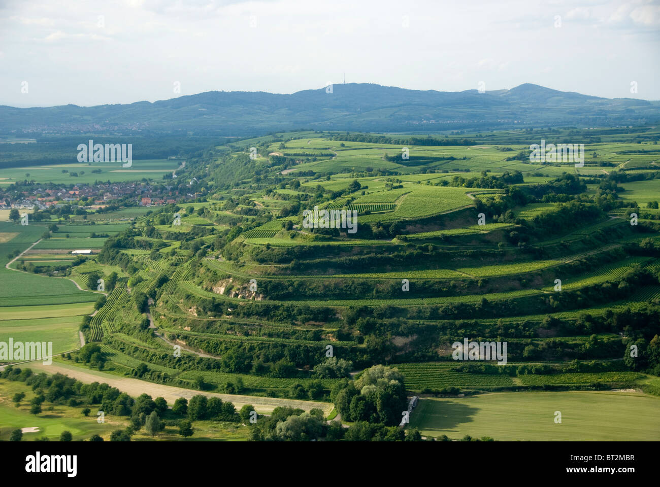 Hill with trees and other hills in the background Stock Photo - Alamy