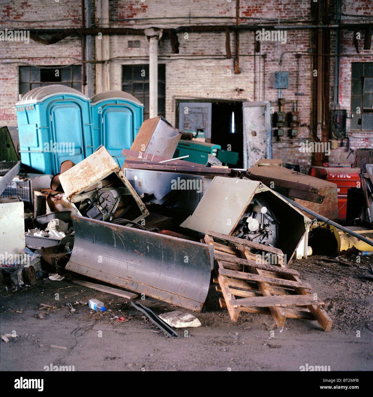 Trash and debris in an old airplane hanger Stock Photo - Alamy