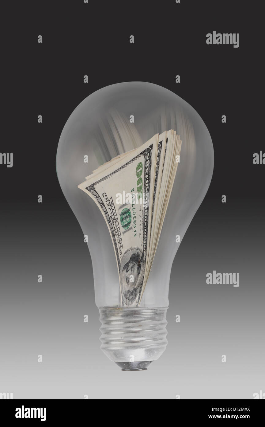 Light bulb and money Stock Photo - Alamy