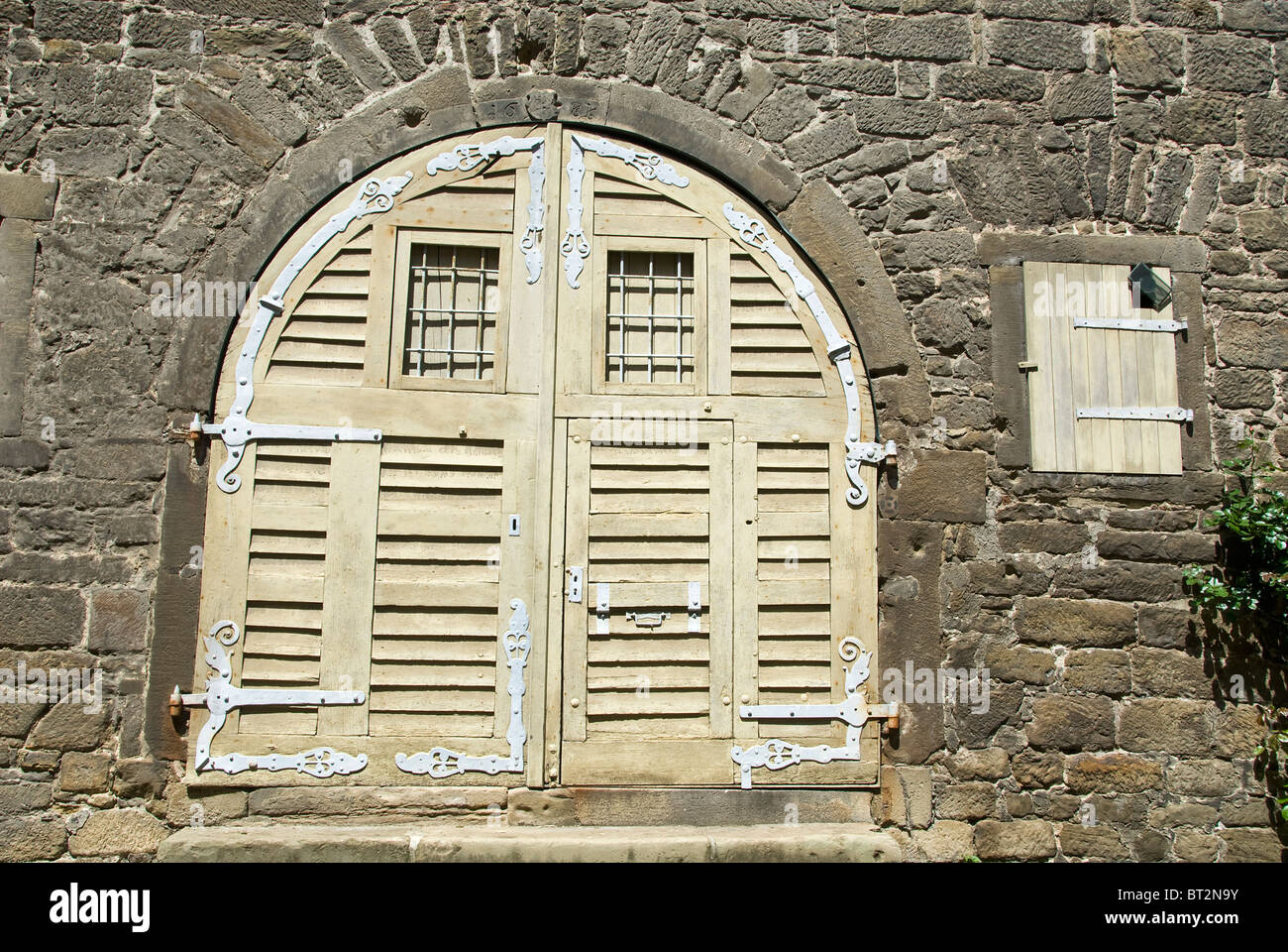 Light white wooden window in a stone wall Stock Photo - Alamy