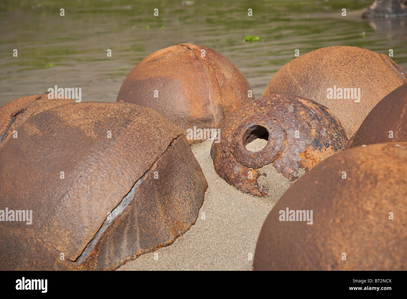 Rusting metal buoys on beach, Norway Stock Photo - Alamy