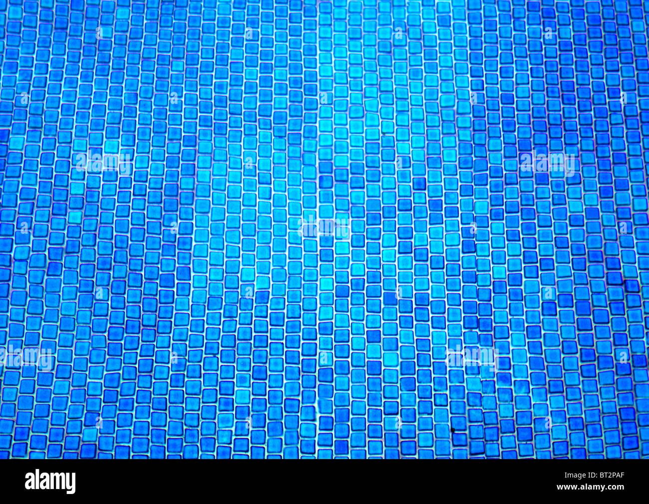 swimming pool tiles through water Stock Photo - Alamy