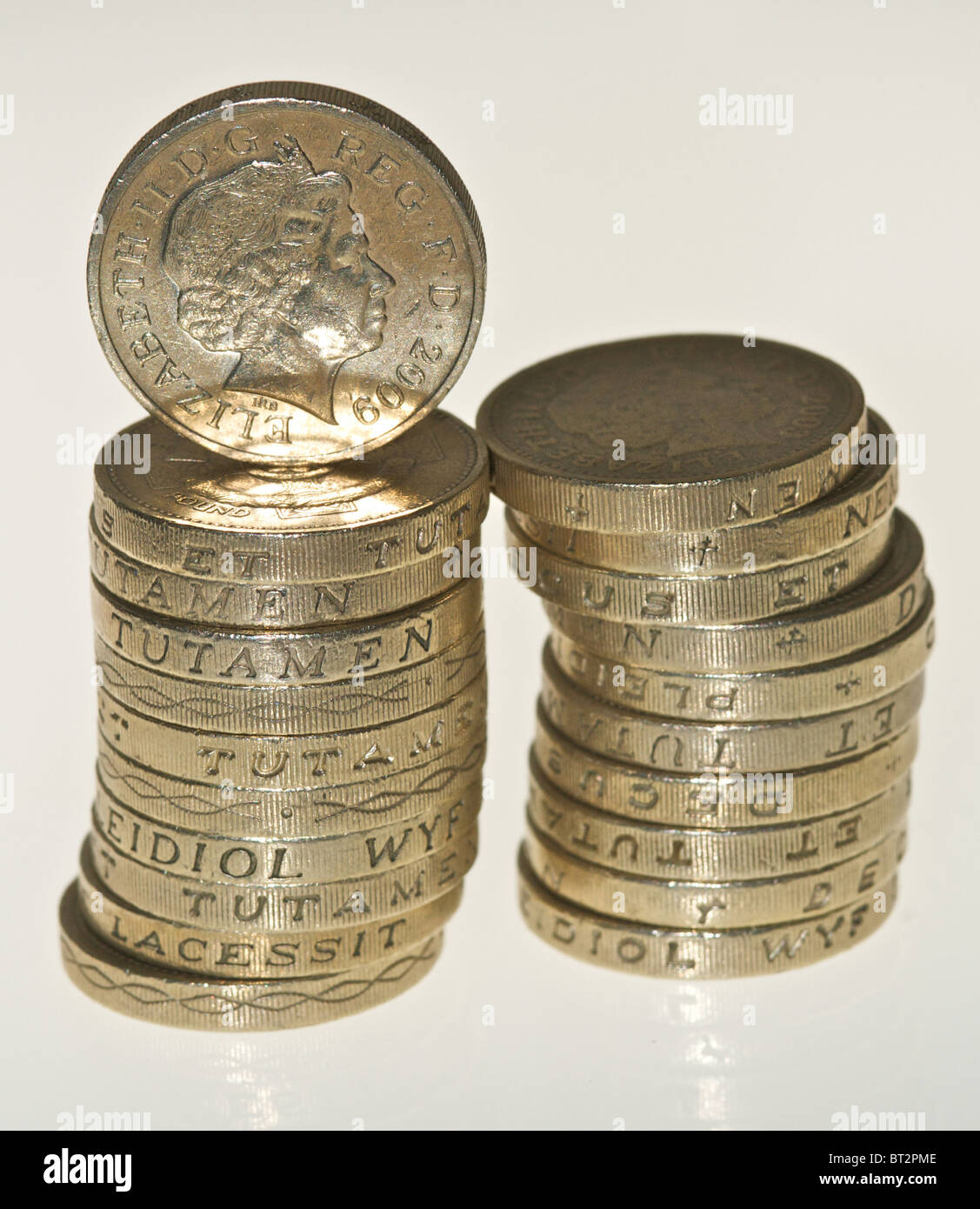 Two piles of UK pound coins Stock Photo - Alamy