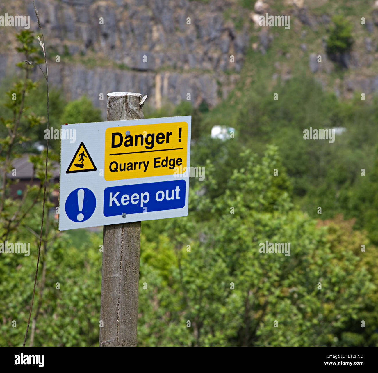 Danger quarry edge sign at disused quarry in Buxton Country Park Buxton ...