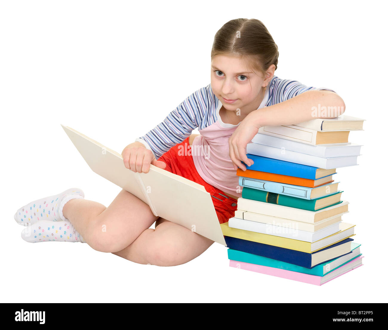 Teenager girl reading book and heap of books Stock Photo - Alamy