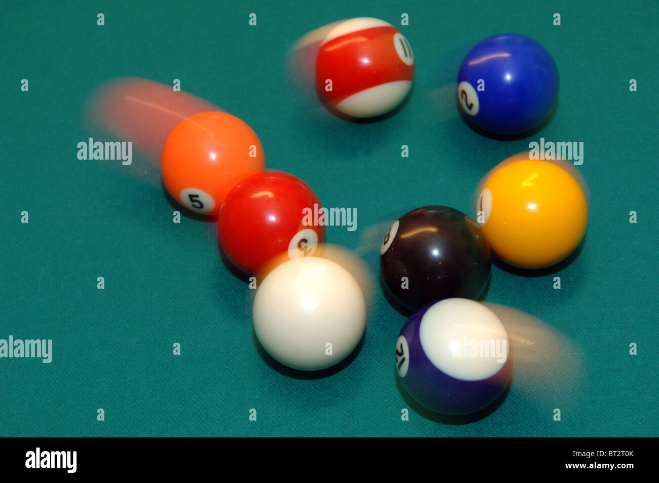 Pool table in action Stock Photo - Alamy