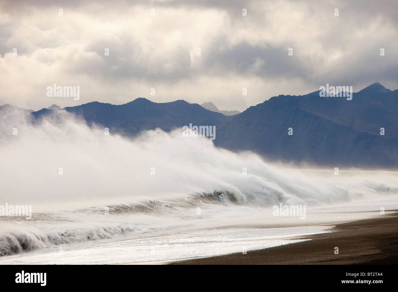 Storm force winds blowing spray off the sea surface in Hamarsfjordur ...