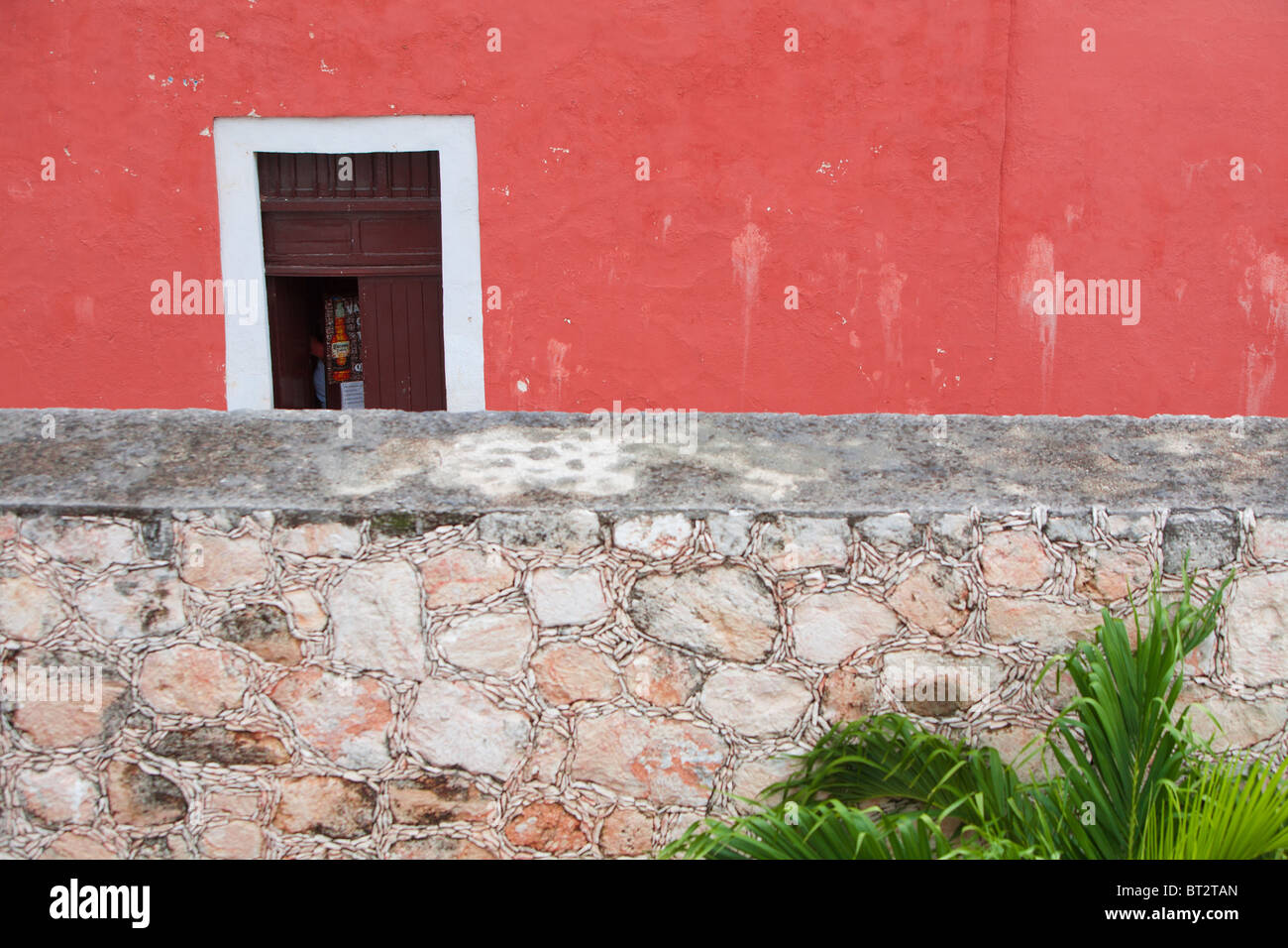 View of a colored grocery store and the stone wall of Campeche, Mexico ...