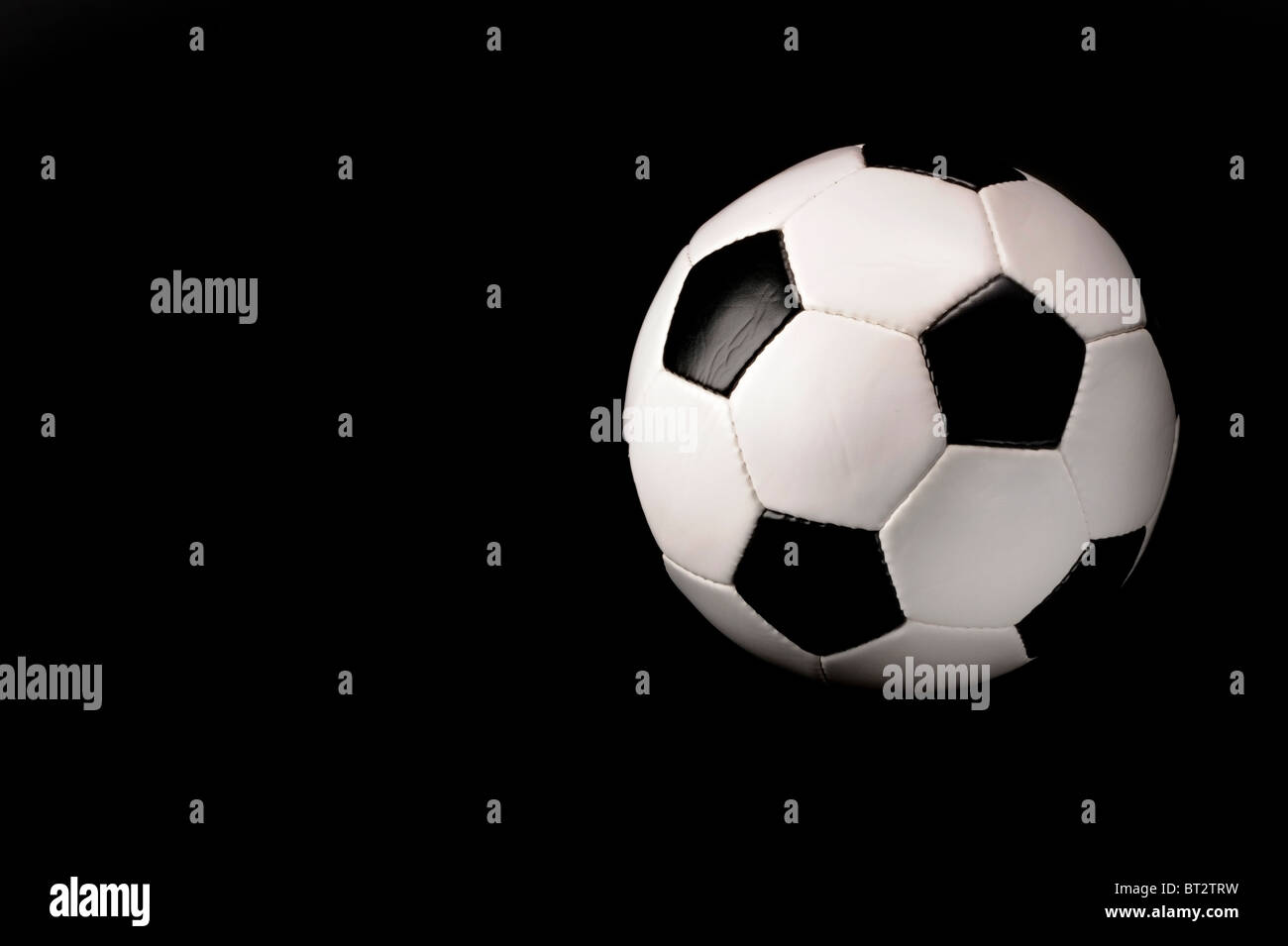 Soccer ball on black background Stock Photo - Alamy