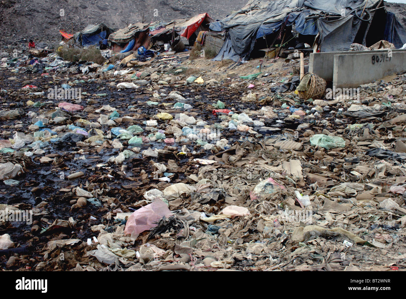 Shacks used by trash workers to protect themselves from hot sun and ...