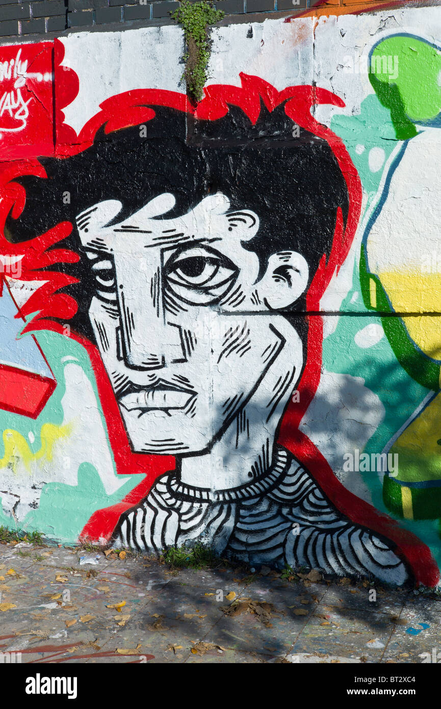 Graffiti on a wall in Munich showing a comic like male face, Germany ...