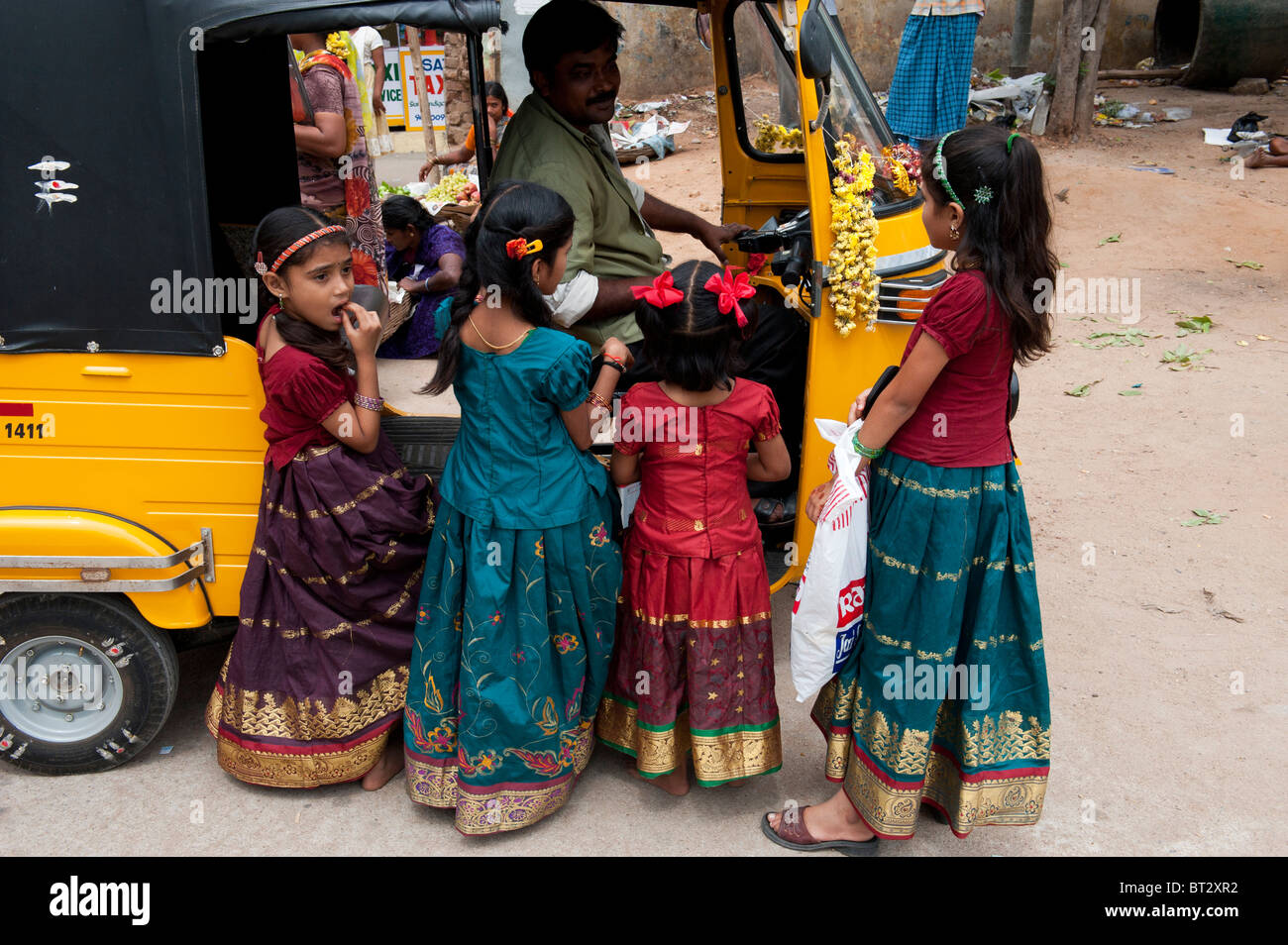 Children getting in a indian rickshaw hi-res stock photography and ...
