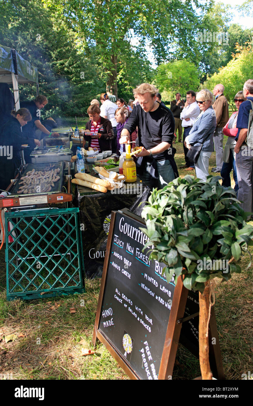 People lining up to enjoy the food on offer at a giant BBQ during the ...
