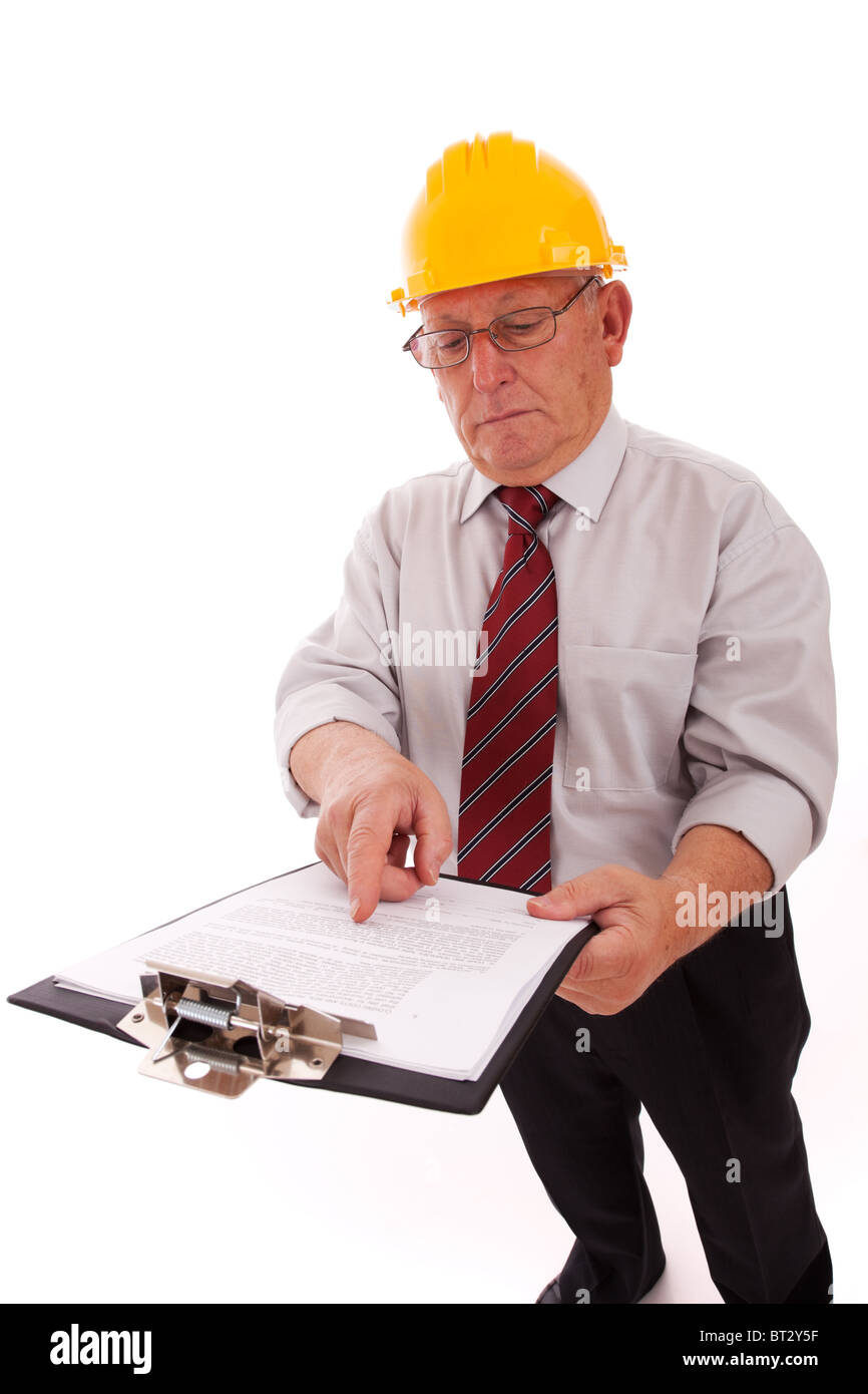 Experienced engineer looking to the clipboard (isolated on white Stock ...