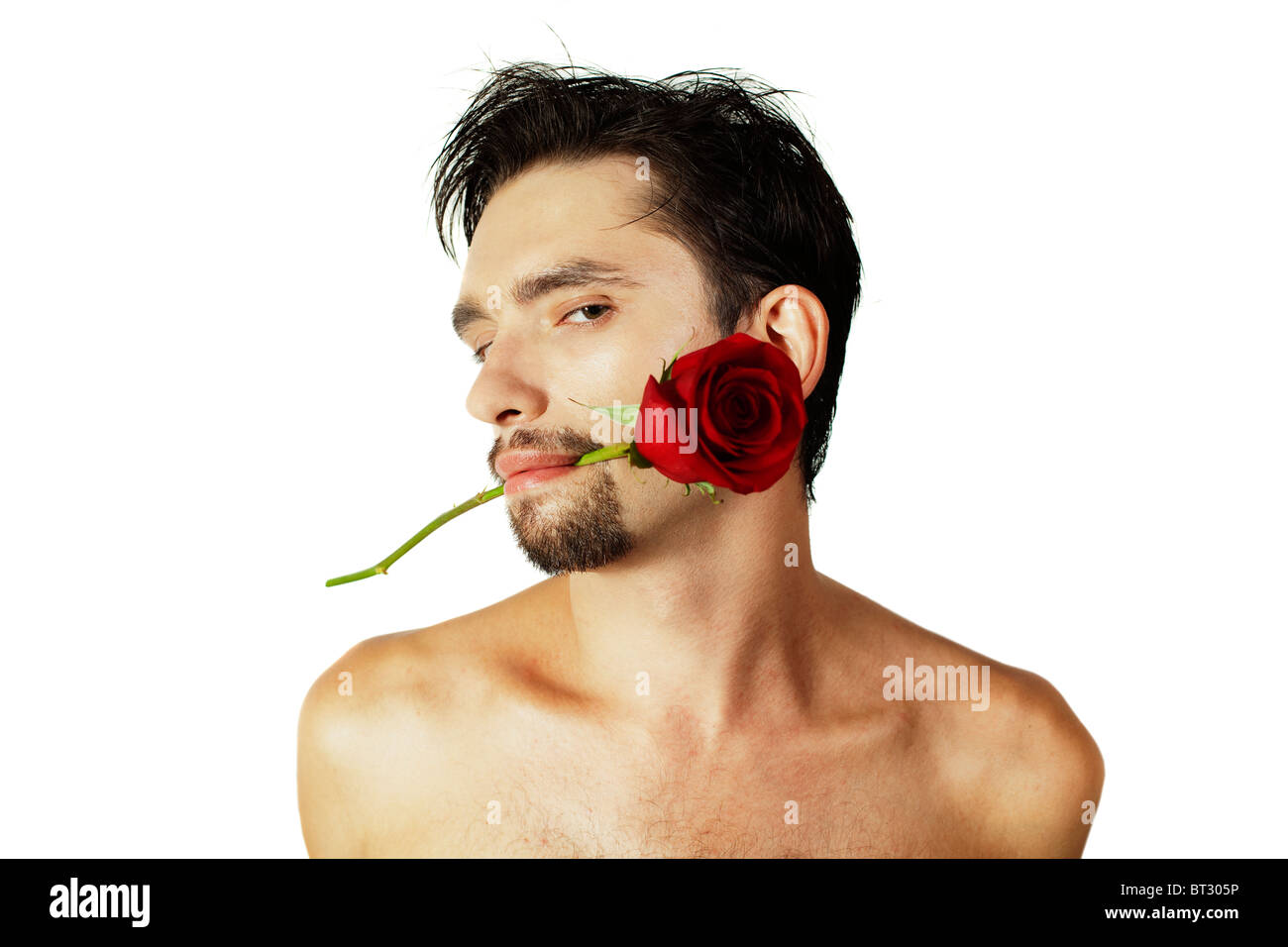 young man with a rose in its mouth on a white background Stock Photo ...