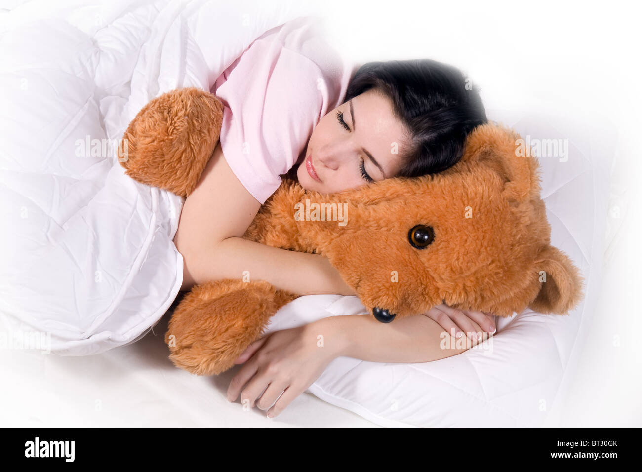 girl sleeping with teddy bear in bed Stock Photo - Alamy