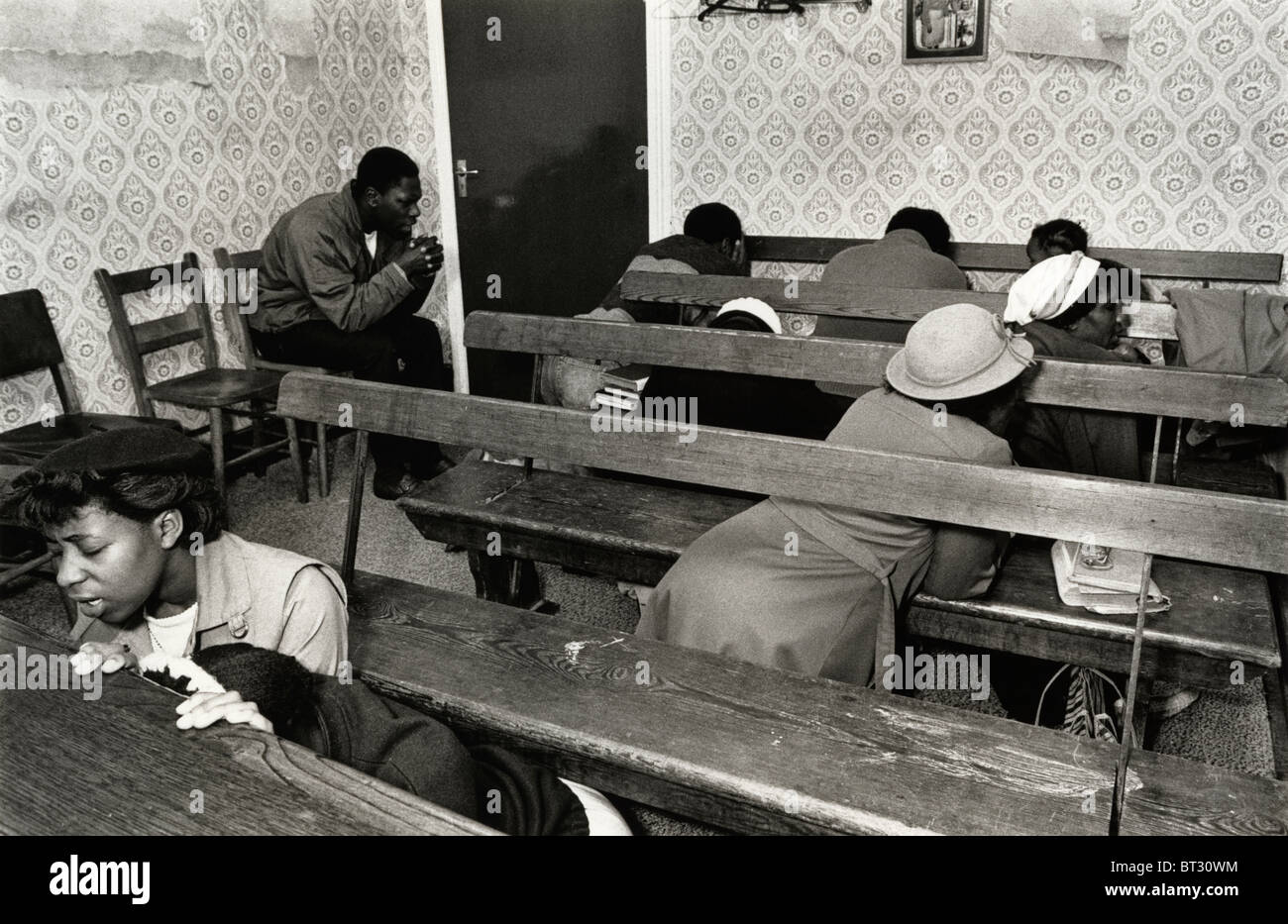 Weekly prayer meeting held in small basement room in the New Testament ...