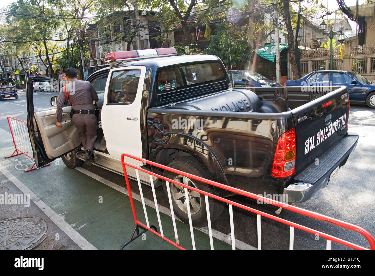 Police car with policeman Stock Photo - Alamy
