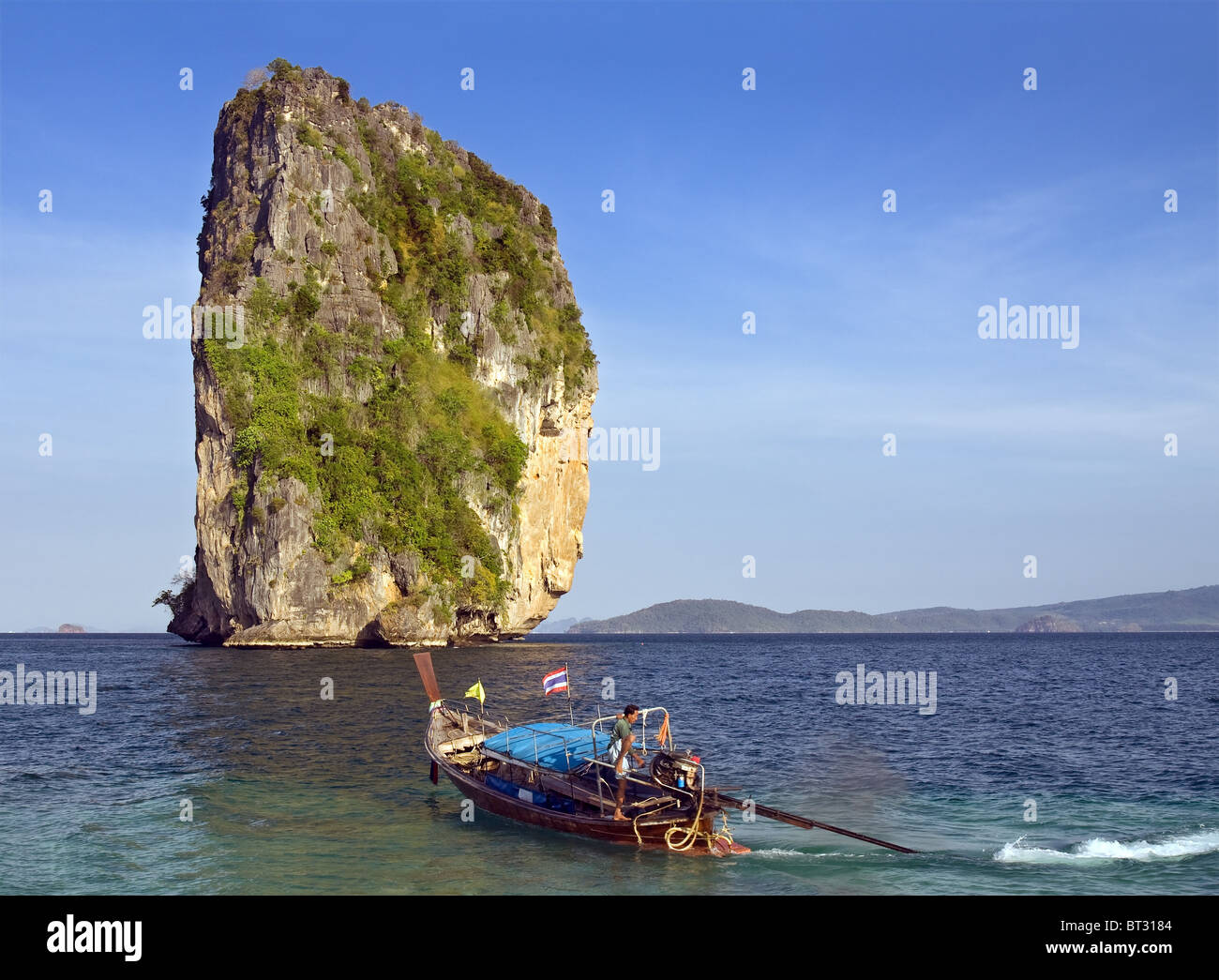 ferry on sea with rock Stock Photo - Alamy