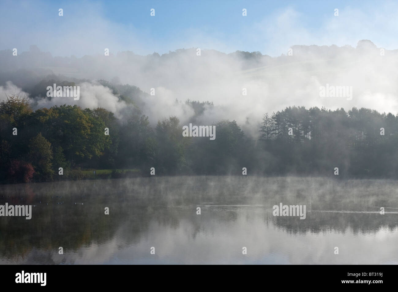 Morning mist rising over a reservoir Stock Photo - Alamy