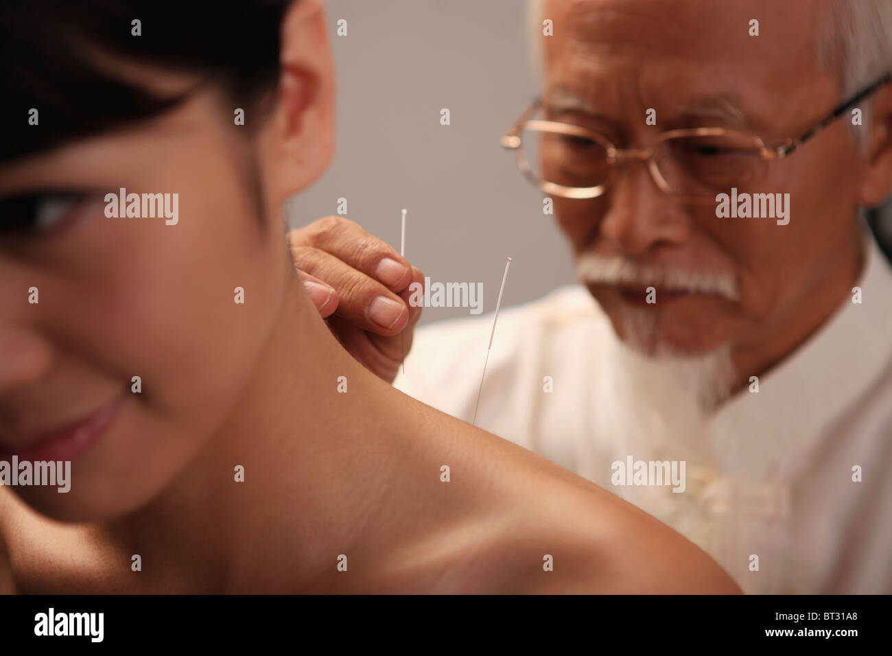 Doctor holding acupuncture needles hi-res stock photography and images ...