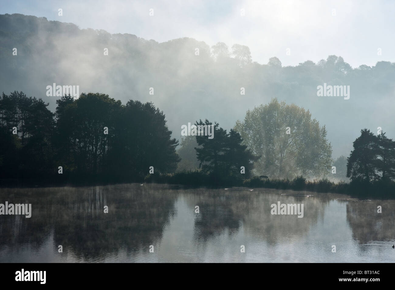 Morning mist rising over a reservoir Stock Photo - Alamy