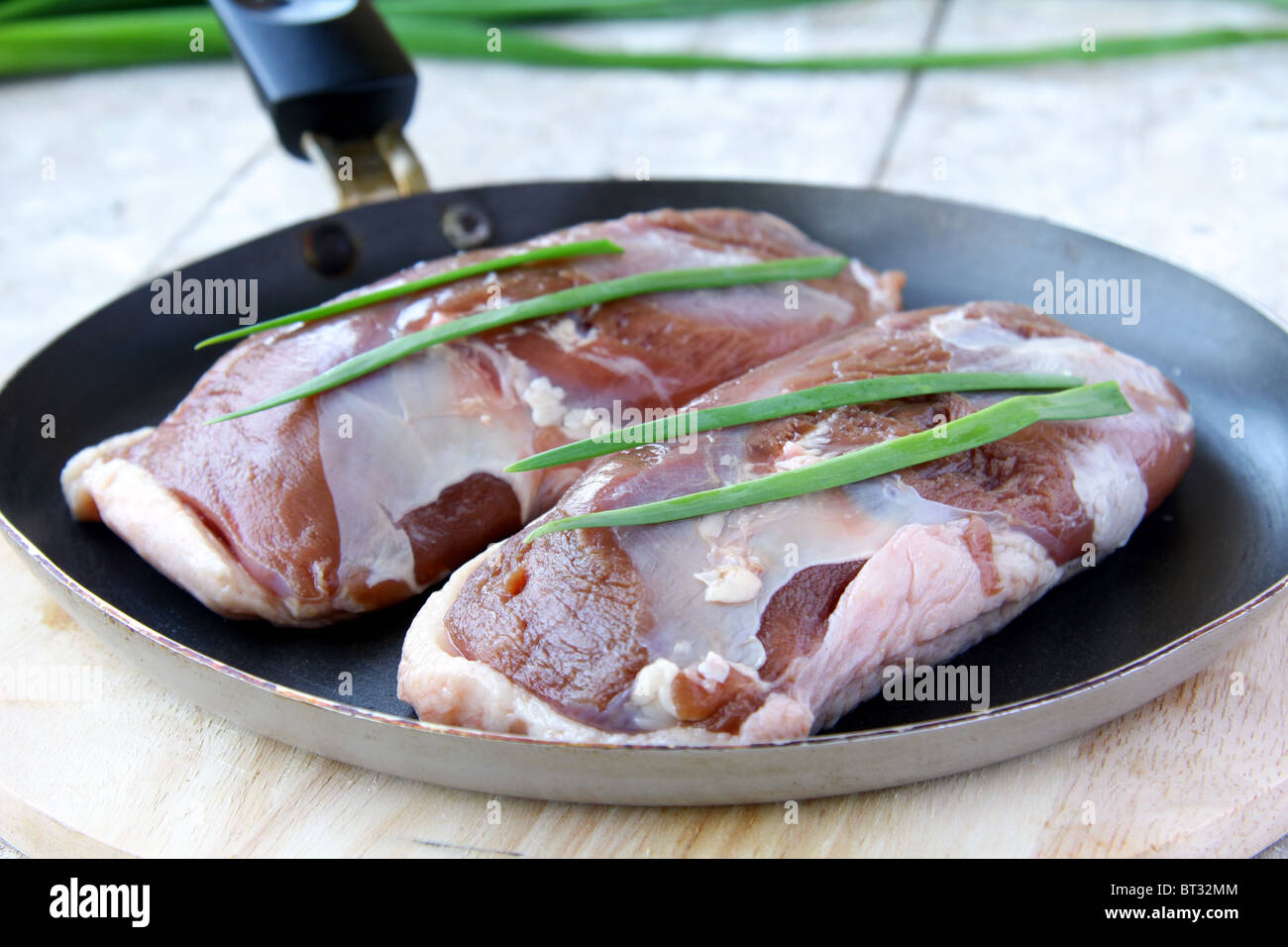 fresh meat duck fillet with green onions Stock Photo - Alamy