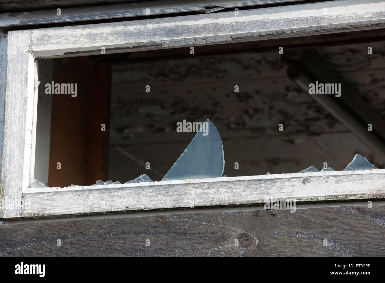 Broken window with glass fragments remaining Stock Photo - Alamy