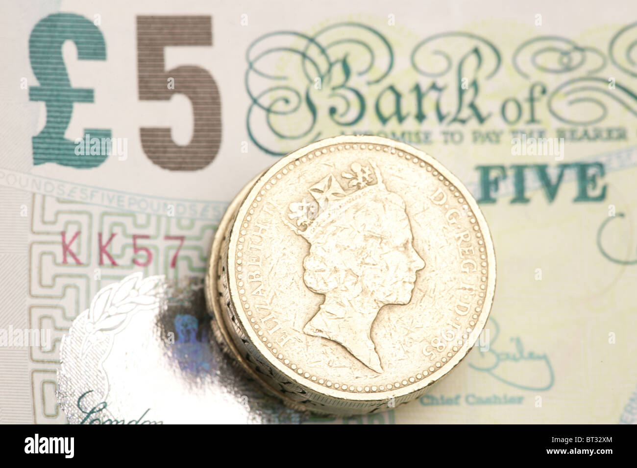 five pound note and pound coins Stock Photo - Alamy